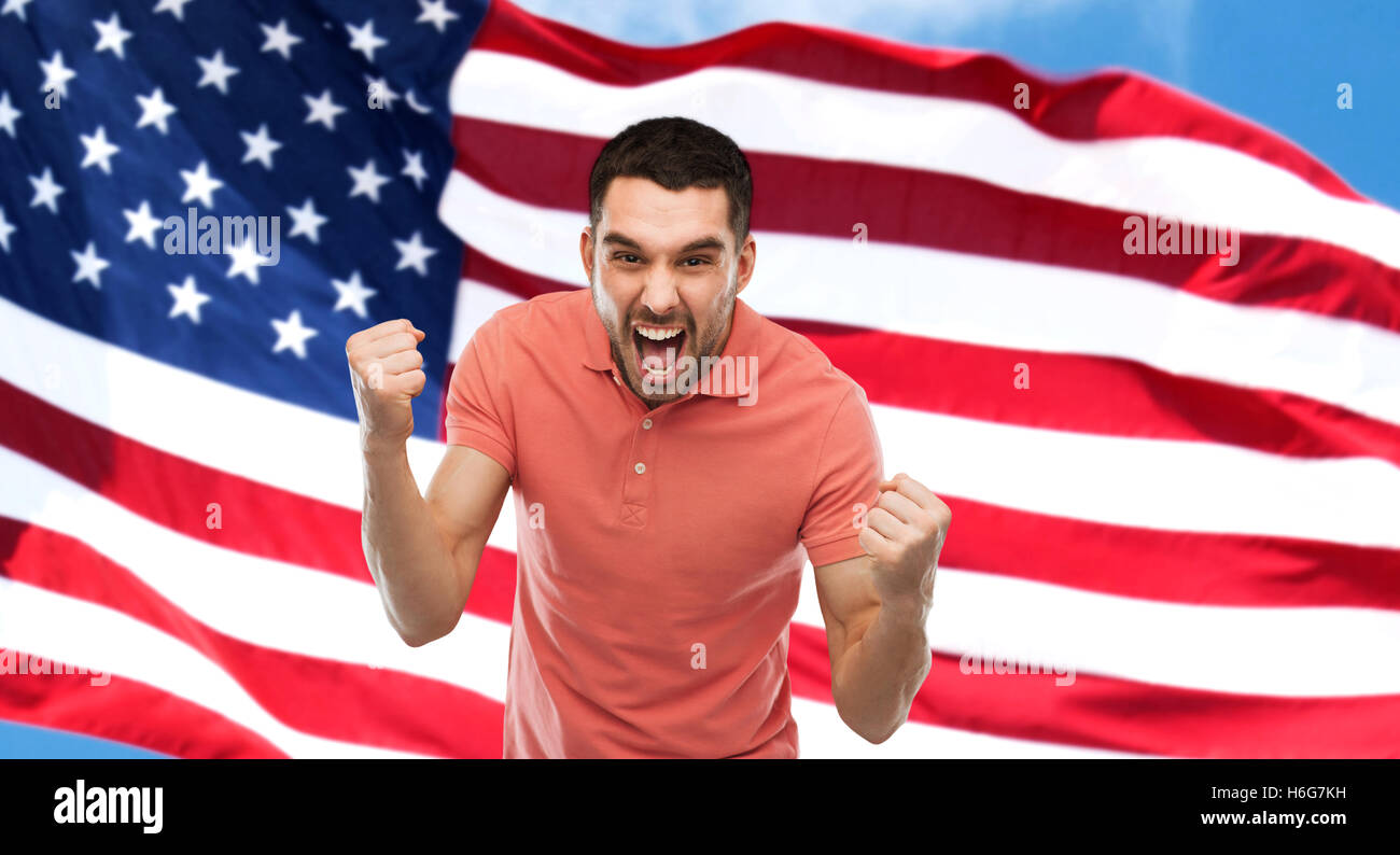 angry man showing fists over american flag Stock Photo - Alamy