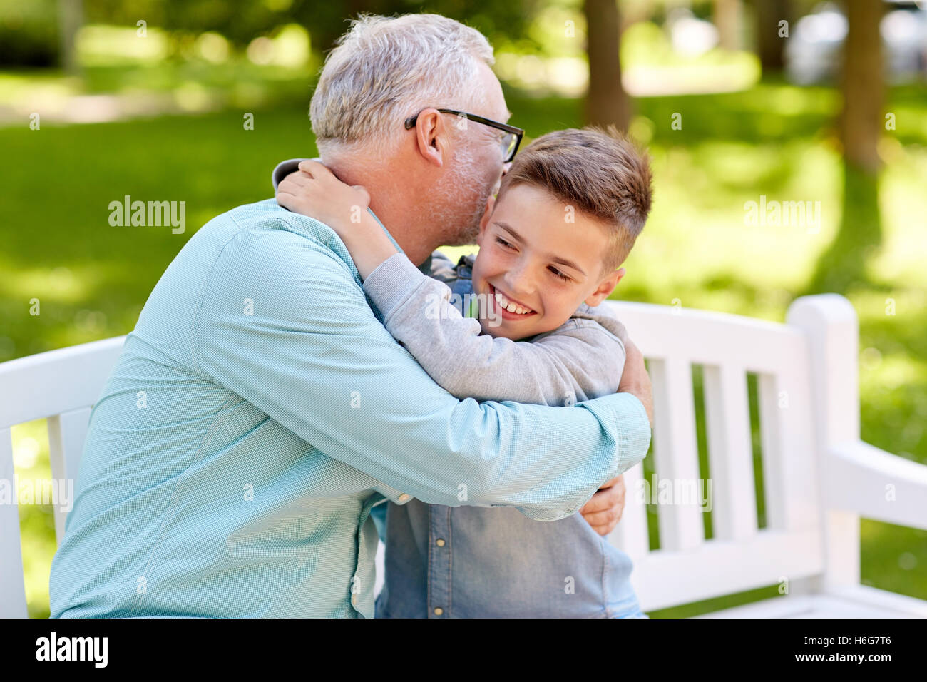 grandfather and grandson hugging at summer park Stock Photo - Alamy
