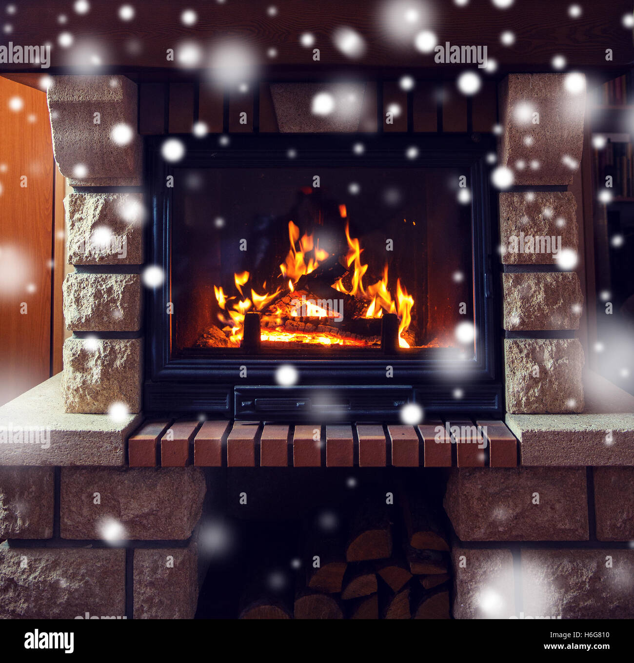 close up of burning fireplace with snow Stock Photo - Alamy