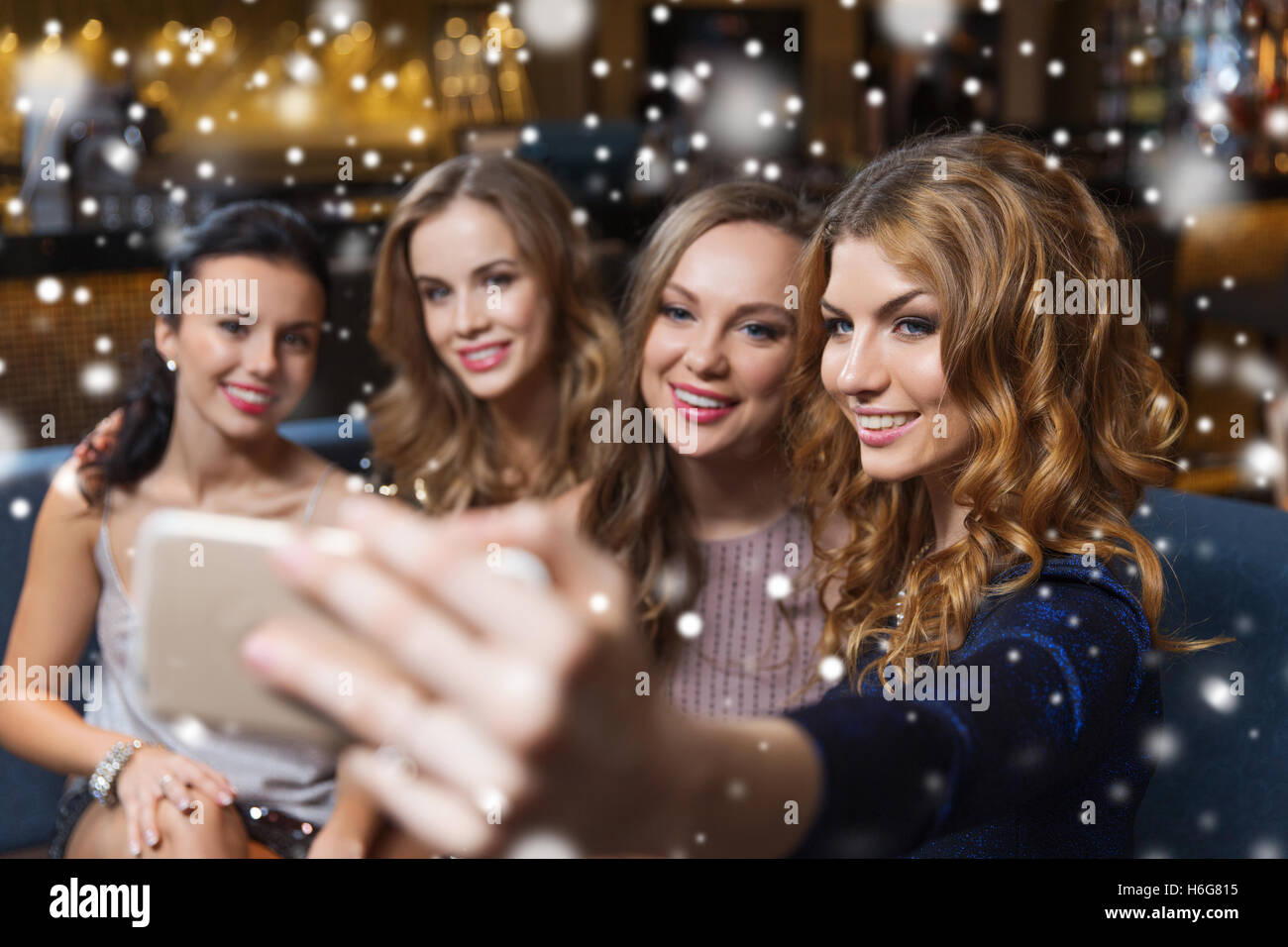 women with smartphone taking selfie at night club Stock Photo - Alamy