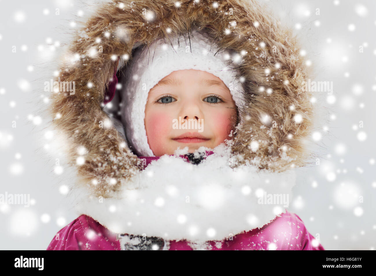 face of happy little kid or girl in winter clothes Stock Photo - Alamy