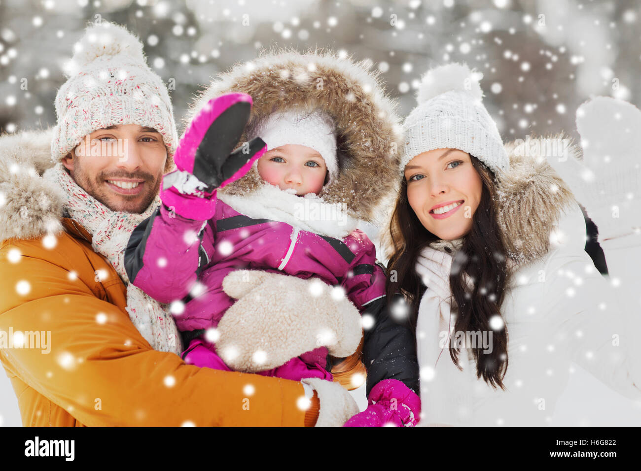 happy family waving hands outdoors in winter Stock Photo - Alamy