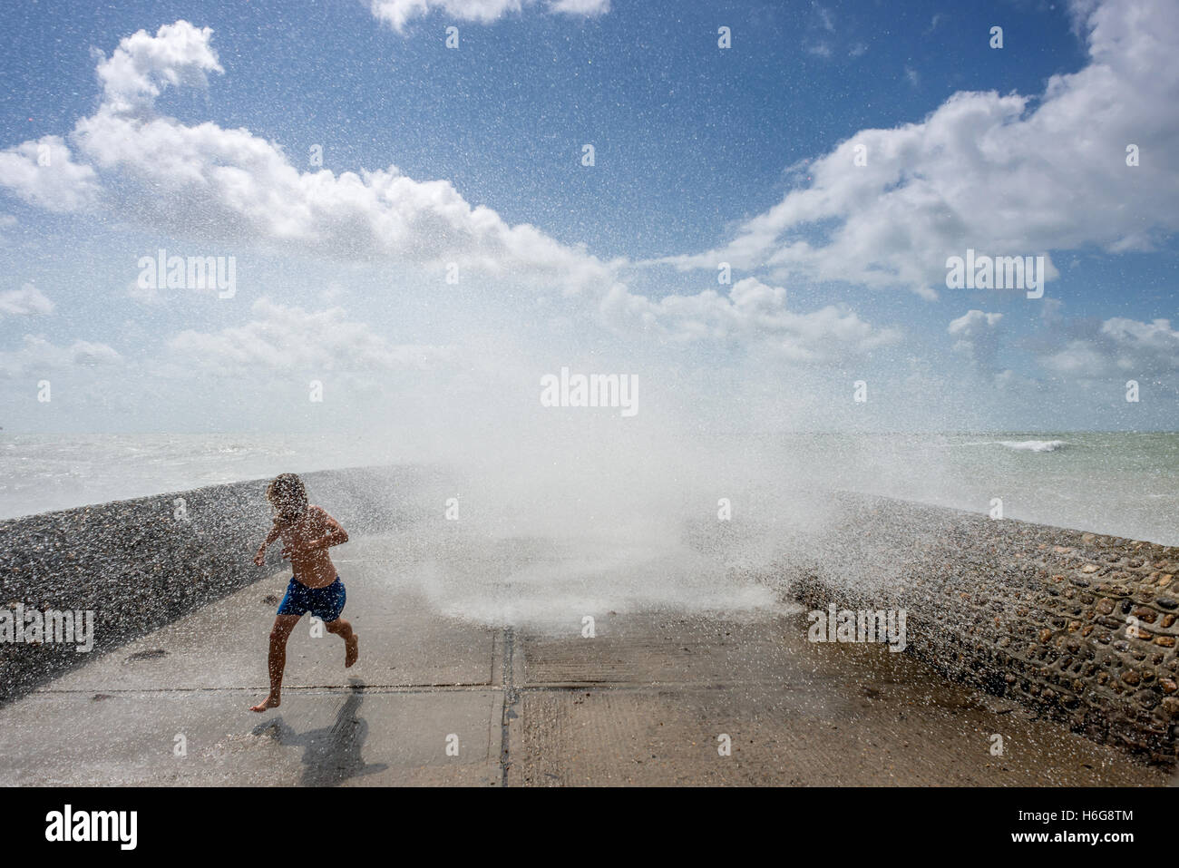 Wave crashing over seawall hi-res stock photography and images - Alamy