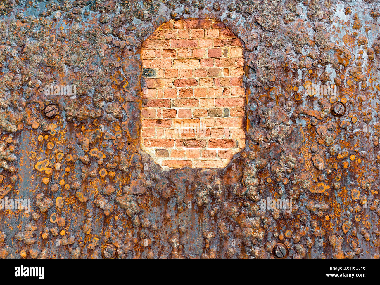 A rusted metal wall panel of Hurst Castle, Hampshire, UK with an ...