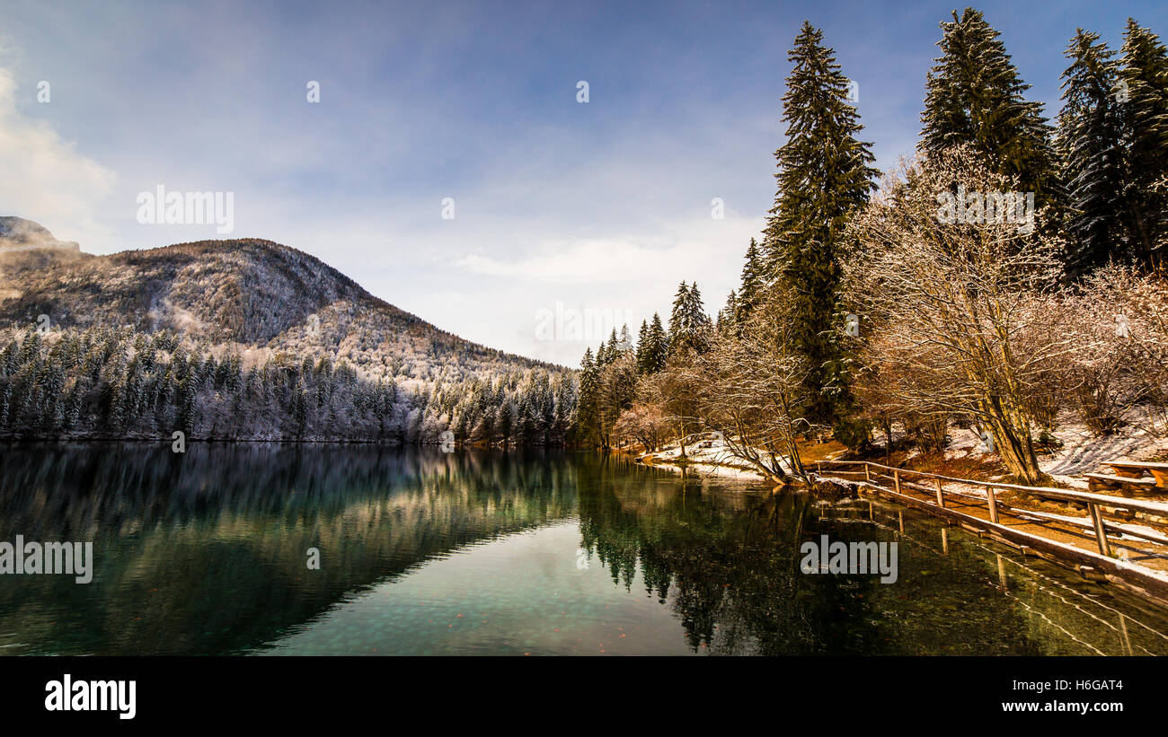 First snow of the winter at a lake in the italian alps Stock Photo - Alamy
