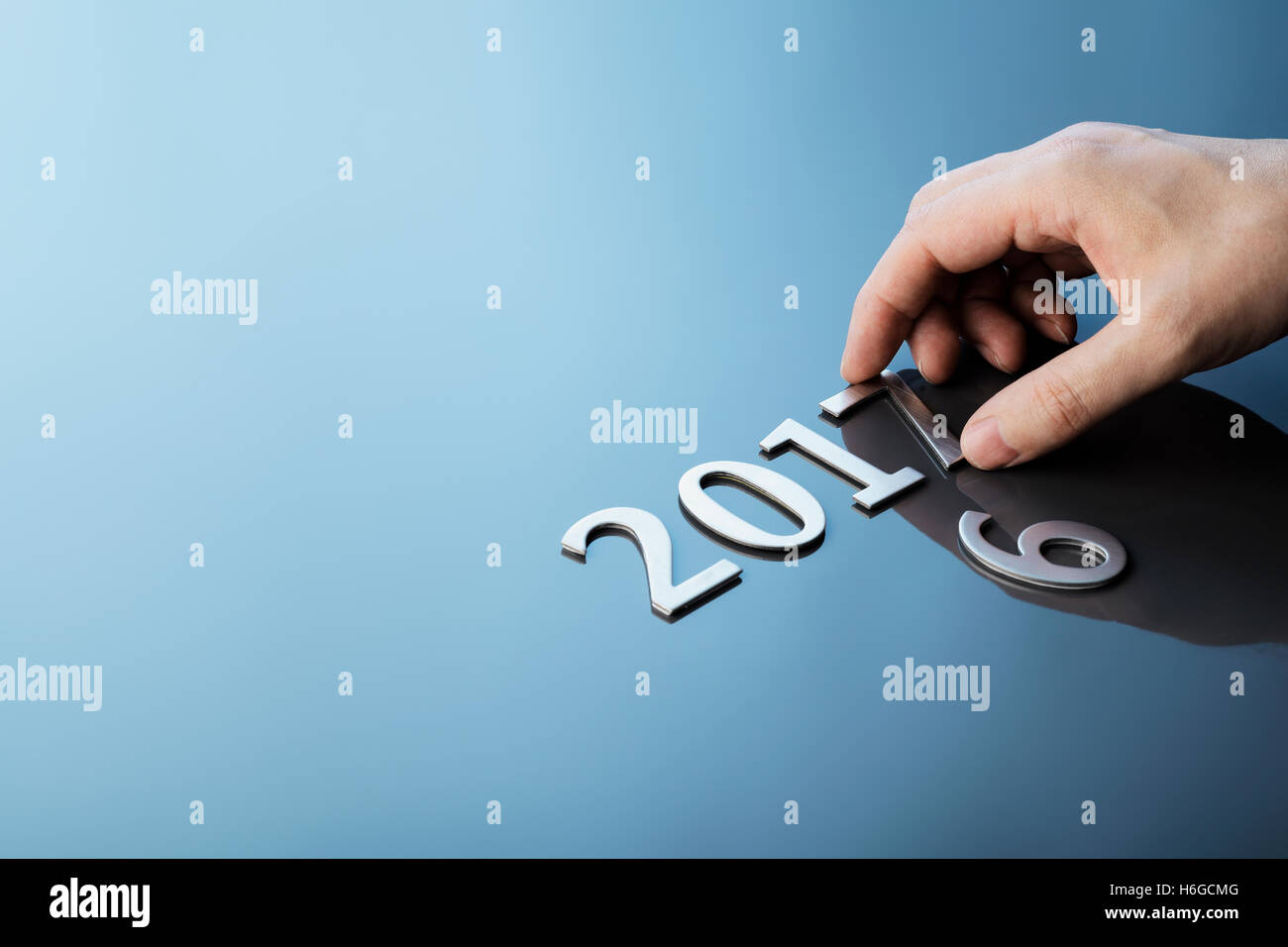Man making number 2017 using metallic numbers Stock Photo - Alamy