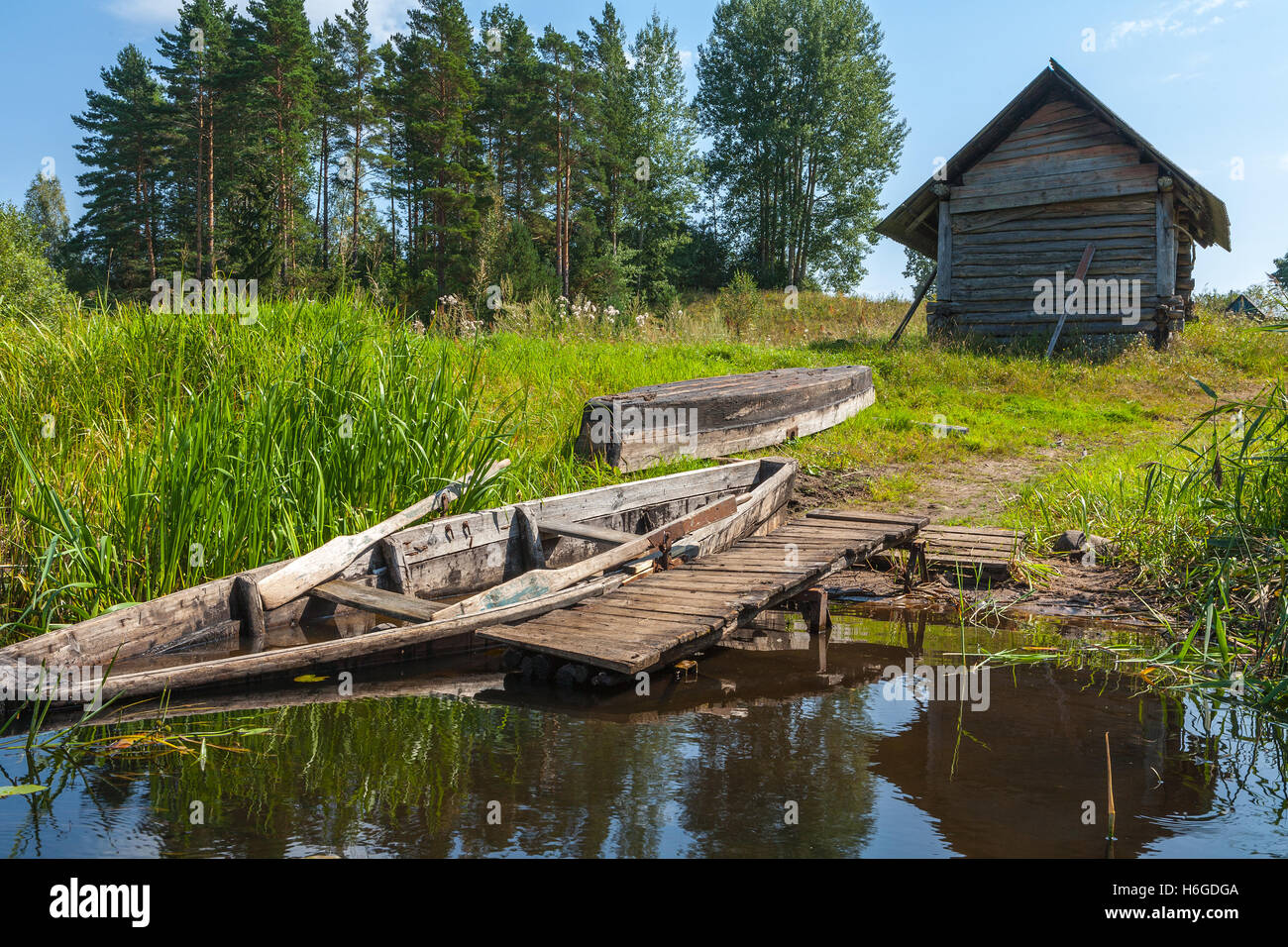 The boat on the pier and the bath-house Stock Photo - Alamy