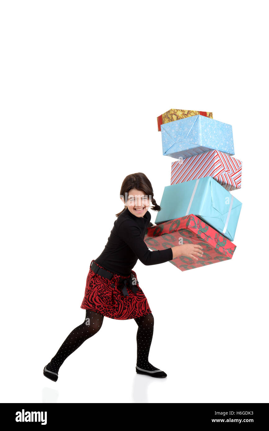 young girl dropping pile of christmas gifts Stock Photo - Alamy