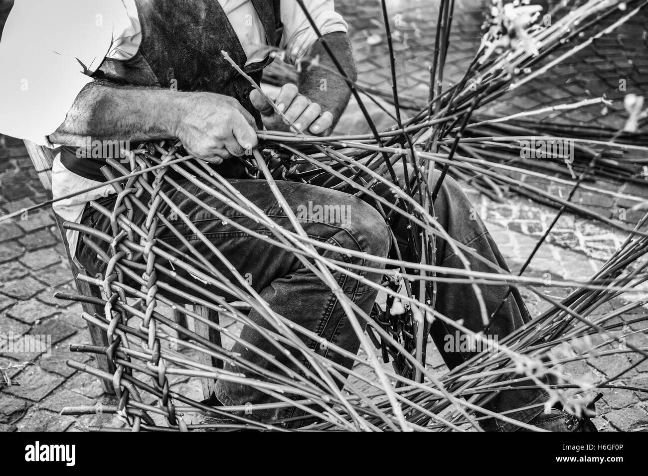 Artisan builds wicker baskets using Black and White Stock Photos ...