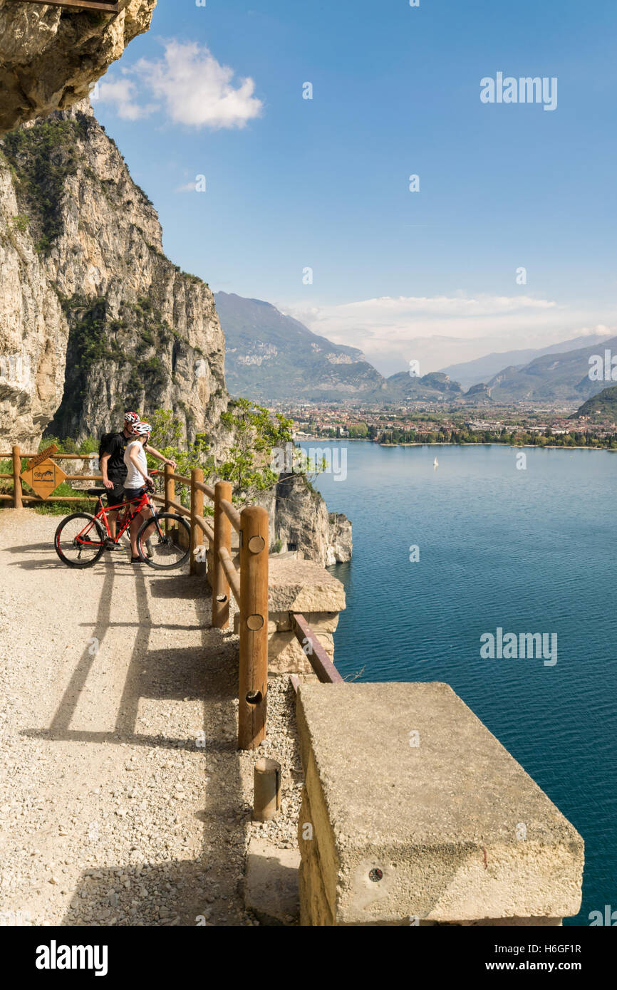 Two cyclists ponale trail in riva del garda hi-res stock photography ...