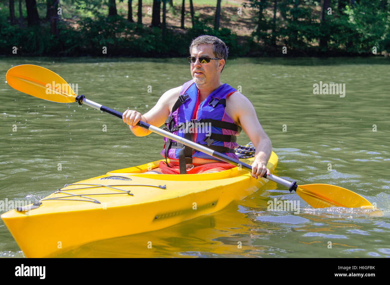 Man sitting in kayak in hi-res stock photography and images - Alamy