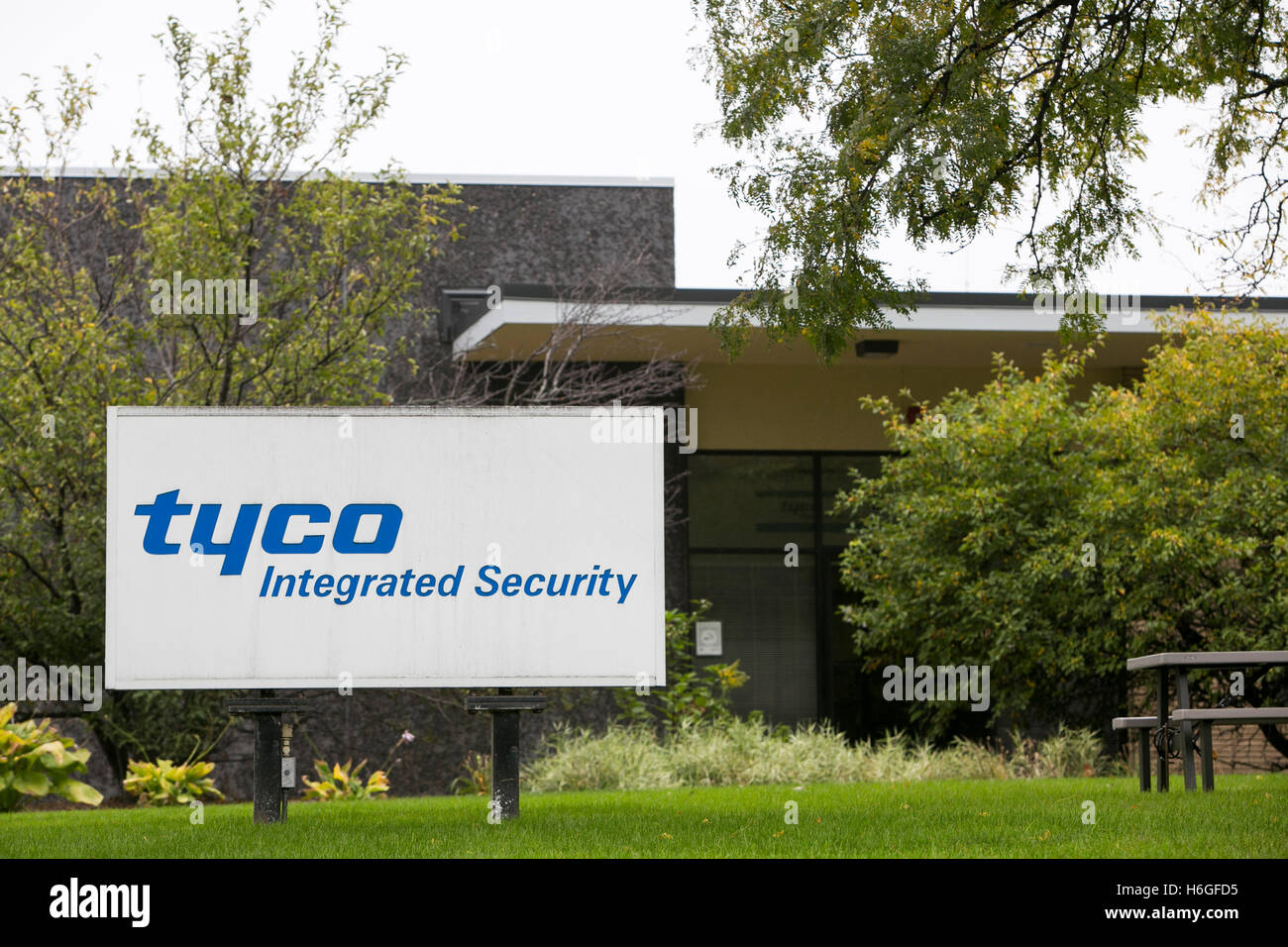 A logo sign outside of a facility occupied by Tyco Integrated Security ...