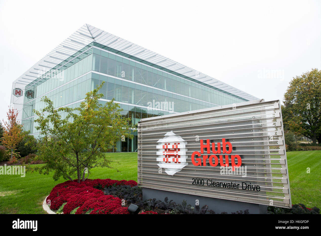 A logo sign outside of the headquarters of The Hub Group in Oak Brook ...