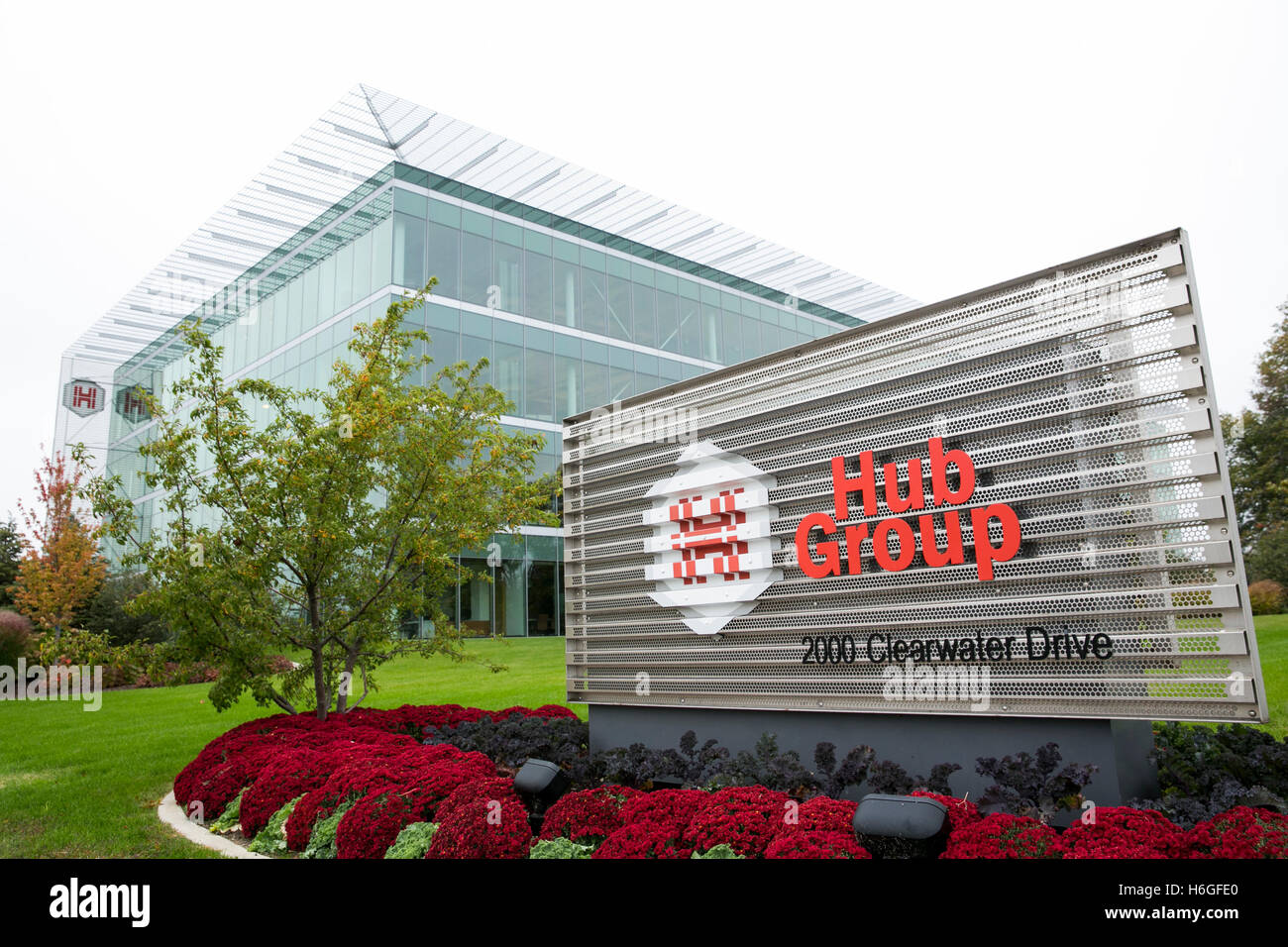 A logo sign outside of the headquarters of The Hub Group in Oak Brook ...