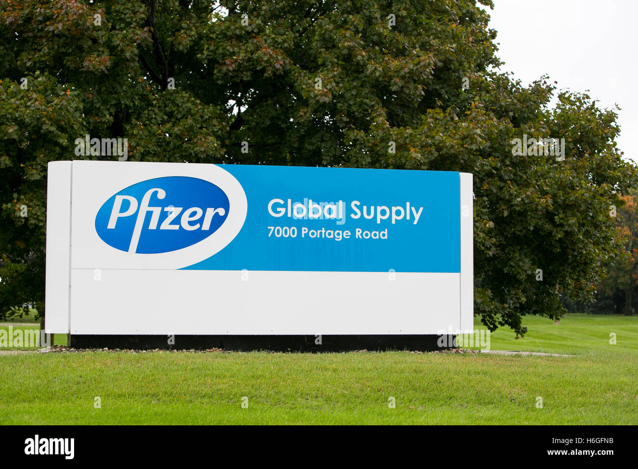 A logo sign outside of a facility occupied by Pfizer Inc., in Kalamazoo ...