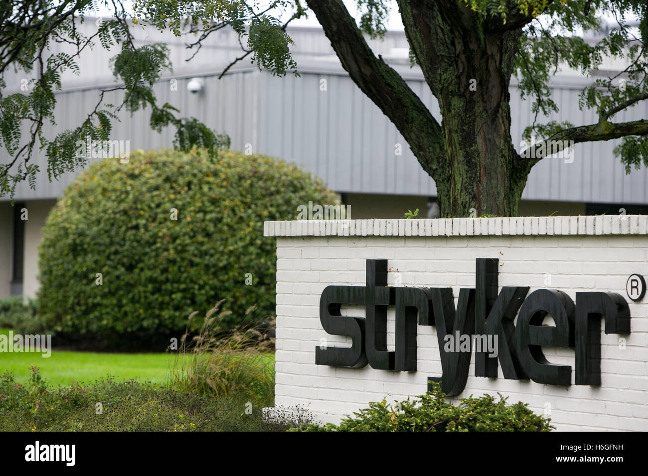 A logo sign outside of a facility occupied by the Stryker Corporation ...
