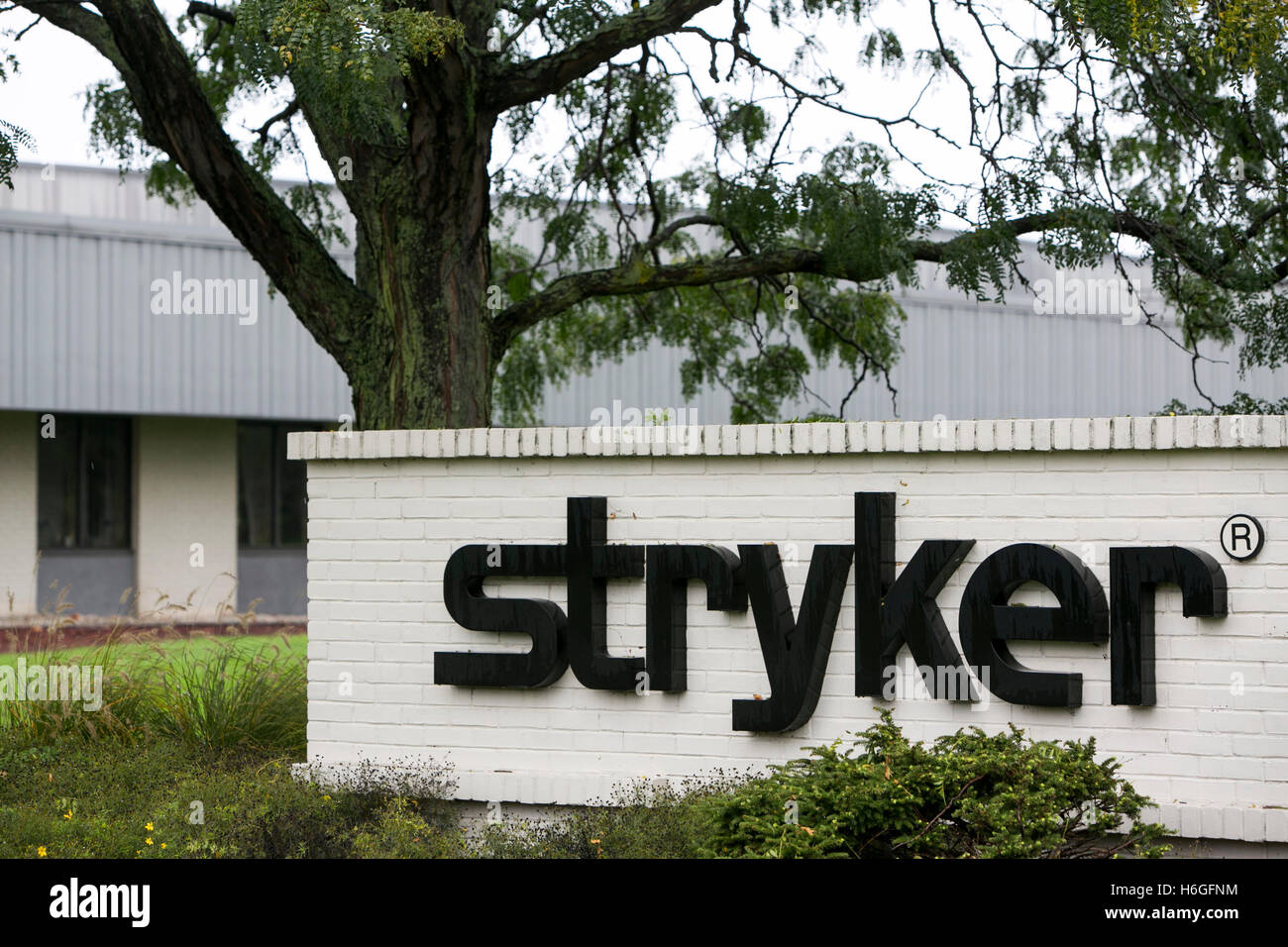 A logo sign outside of a facility occupied by the Stryker Corporation ...