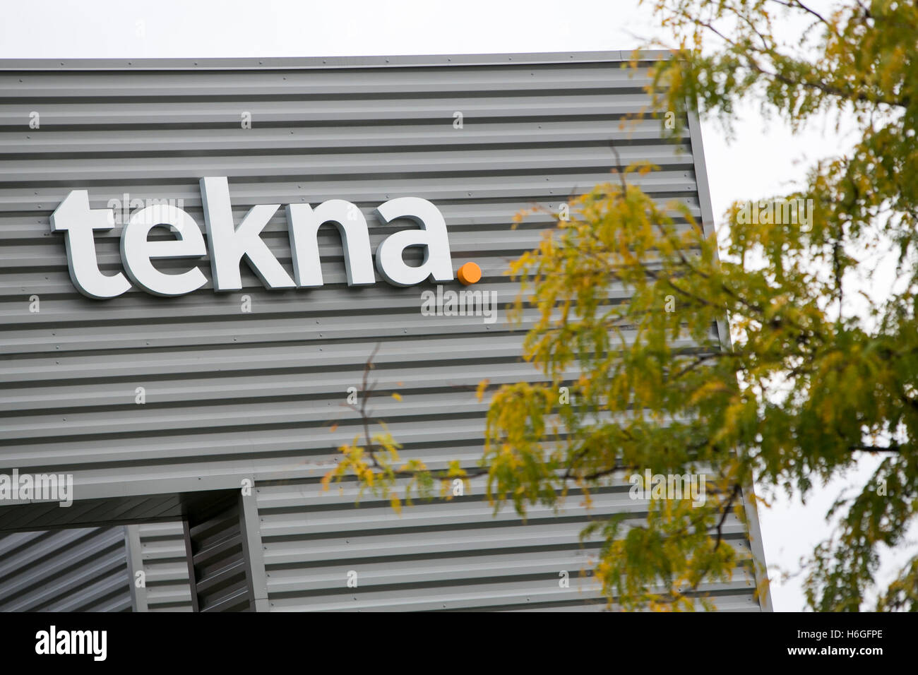 A logo sign outside of a facility occupied by Tekna in Kalamazoo ...