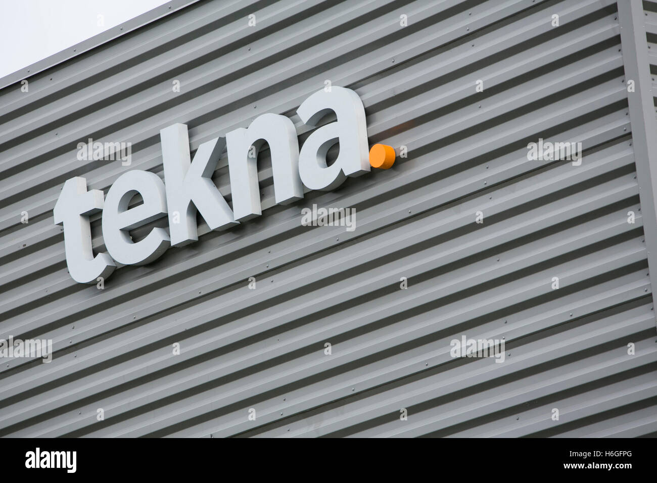 A logo sign outside of a facility occupied by Tekna in Kalamazoo ...