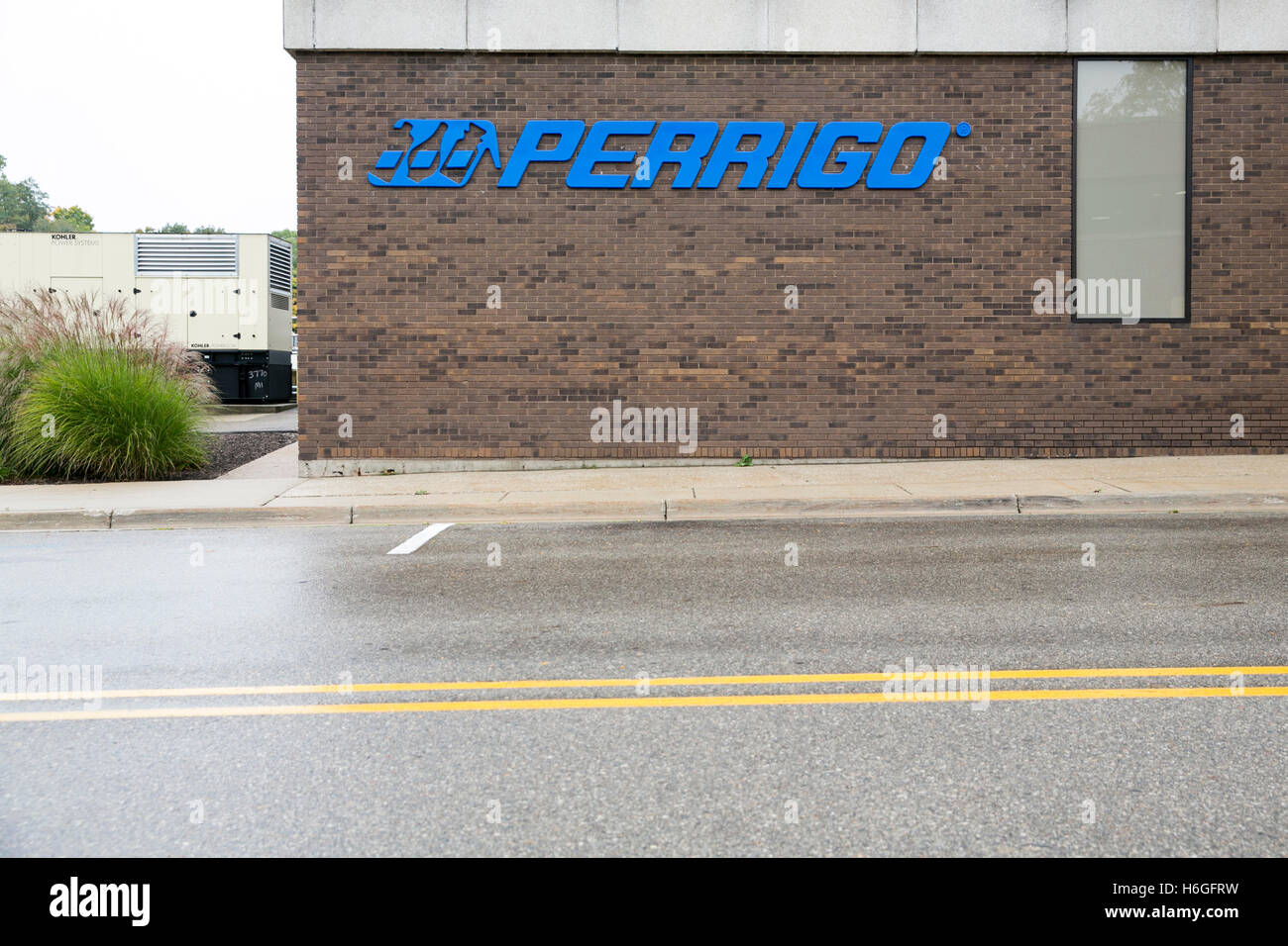 A logo sign outside of a facility occupied by the Perrigo Company in ...