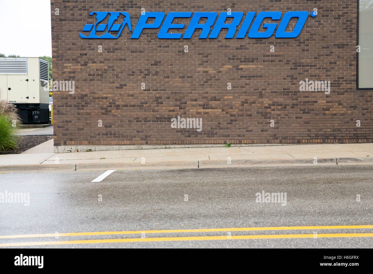 A logo sign outside of a facility occupied by the Perrigo Company in ...