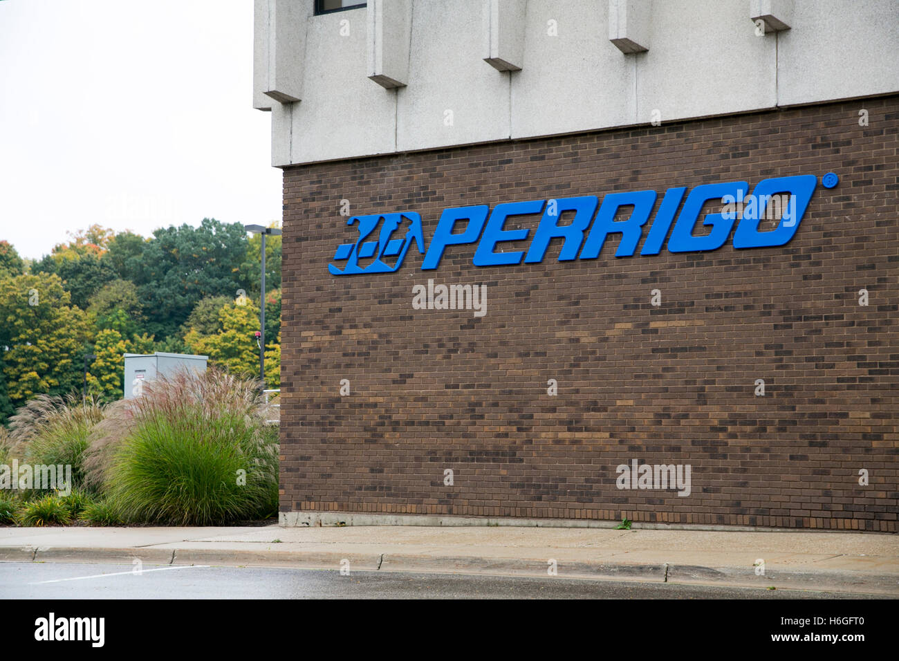 A logo sign outside of a facility occupied by the Perrigo Company in ...