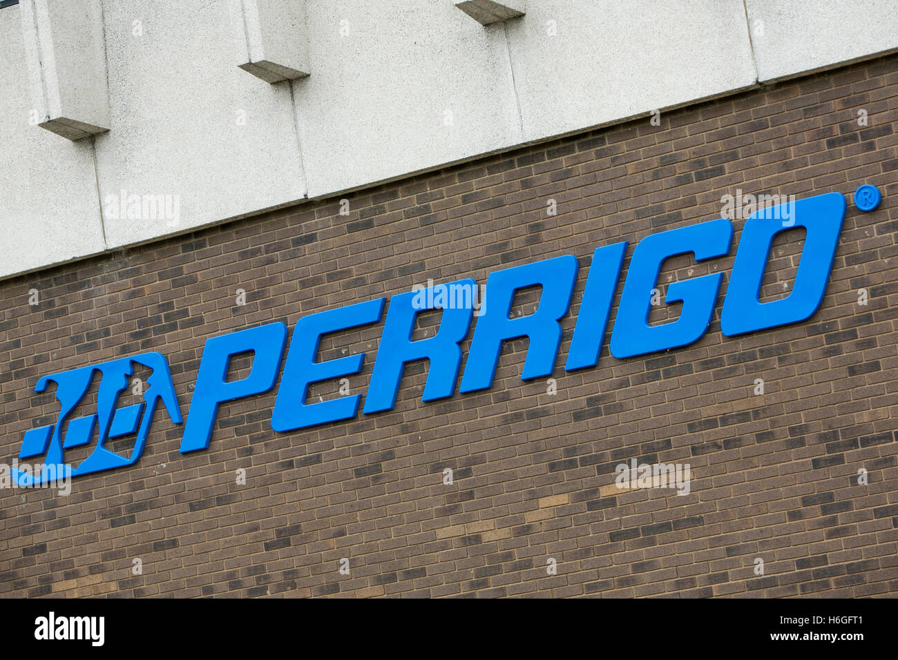 A logo sign outside of a facility occupied by the Perrigo Company in ...