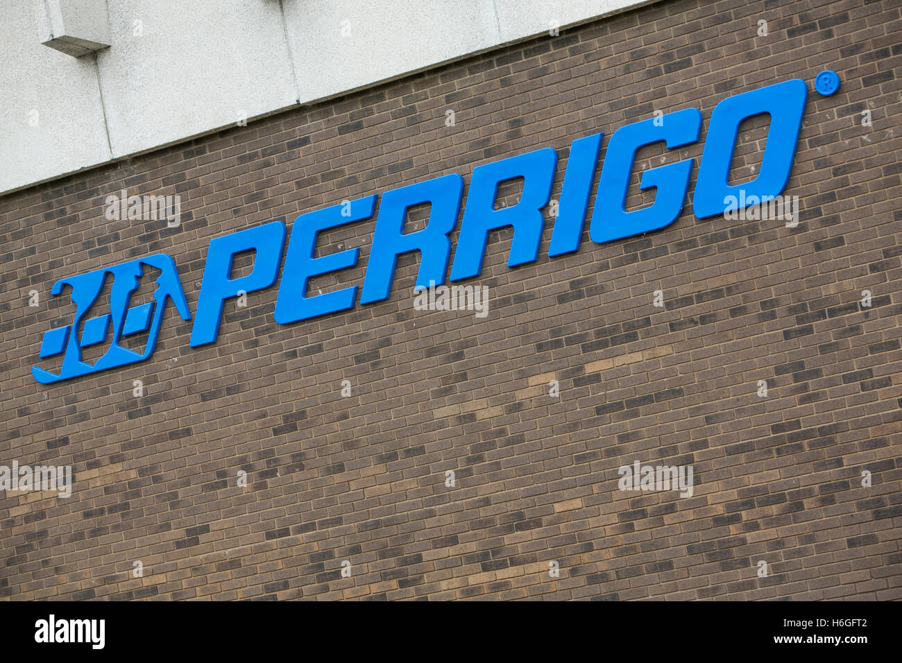 A logo sign outside of a facility occupied by the Perrigo Company in ...