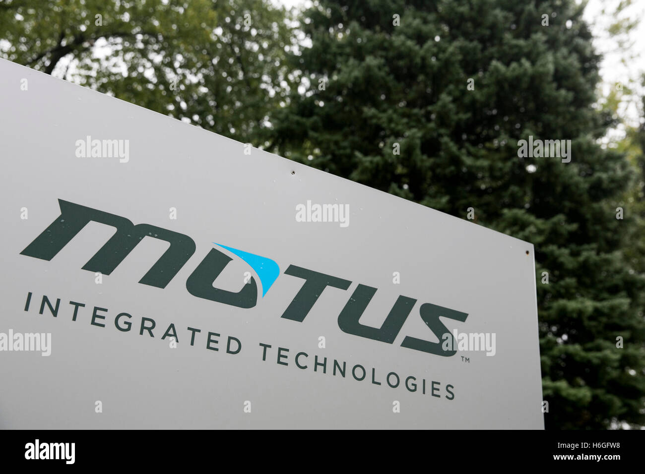 A logo sign outside of the headquarters of Motus Integrated ...