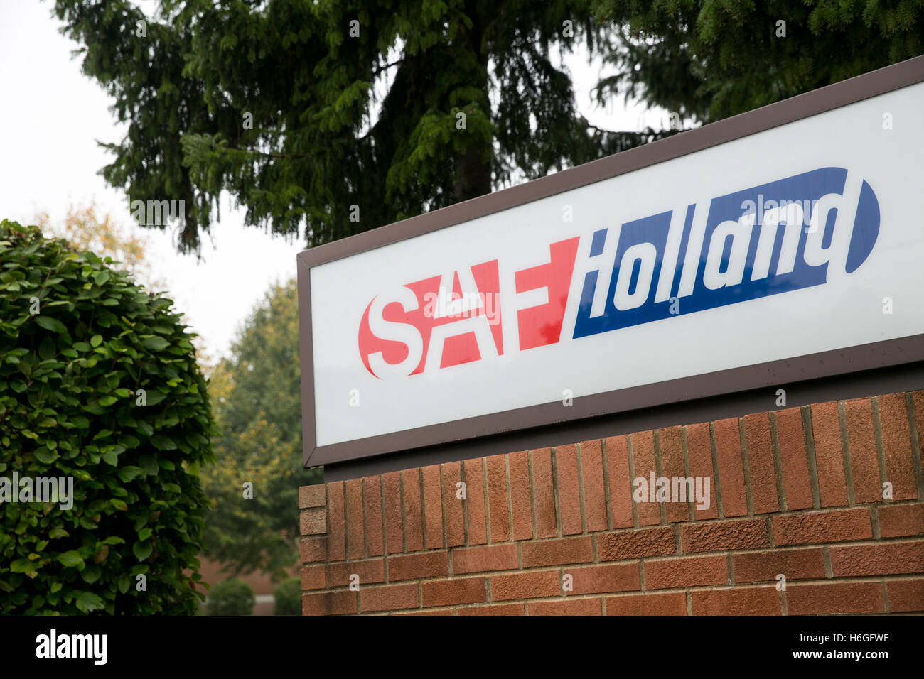A logo sign outside of the headquarters of SAF-HOLLAND in Holland ...
