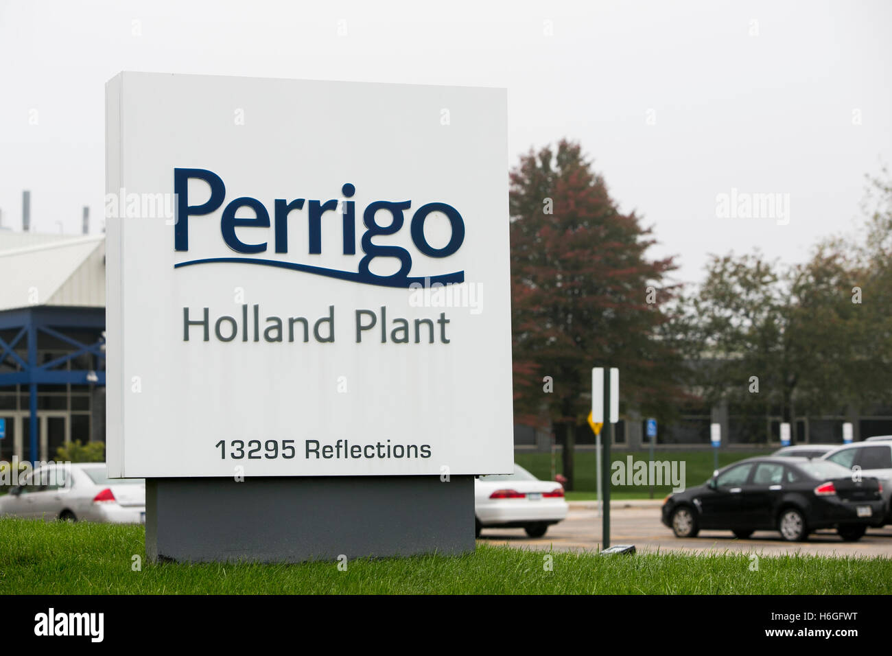 A logo sign outside of a facility occupied by the Perrigo Company in ...
