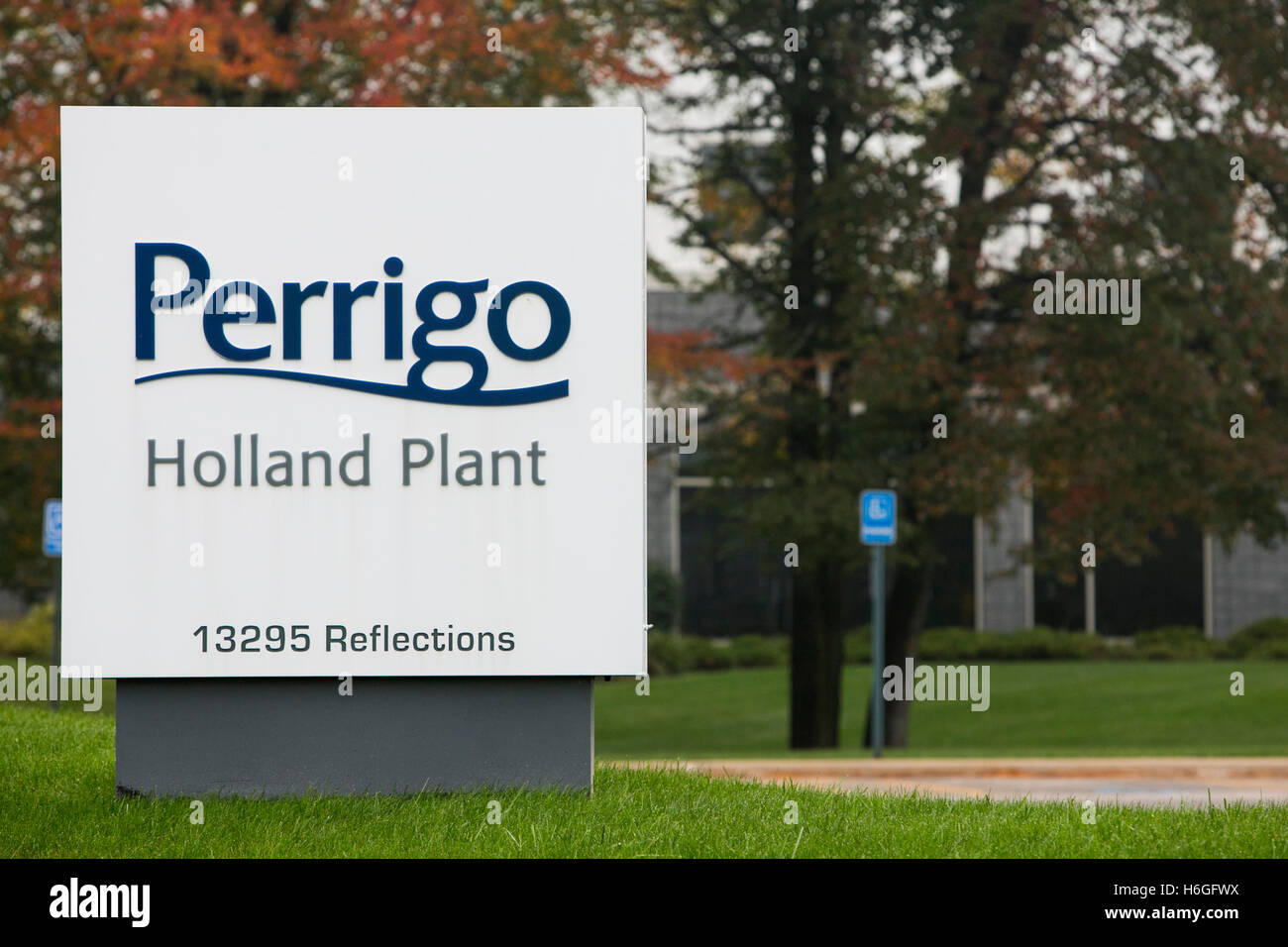A logo sign outside of a facility occupied by the Perrigo Company in ...