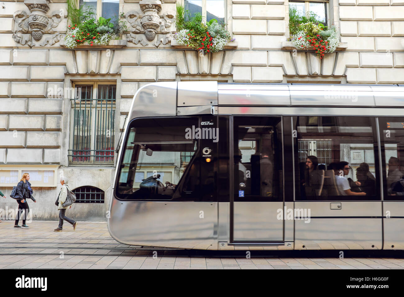 A trolley runs along Rue Nationale and the Hôtel de Ville in Tours ...