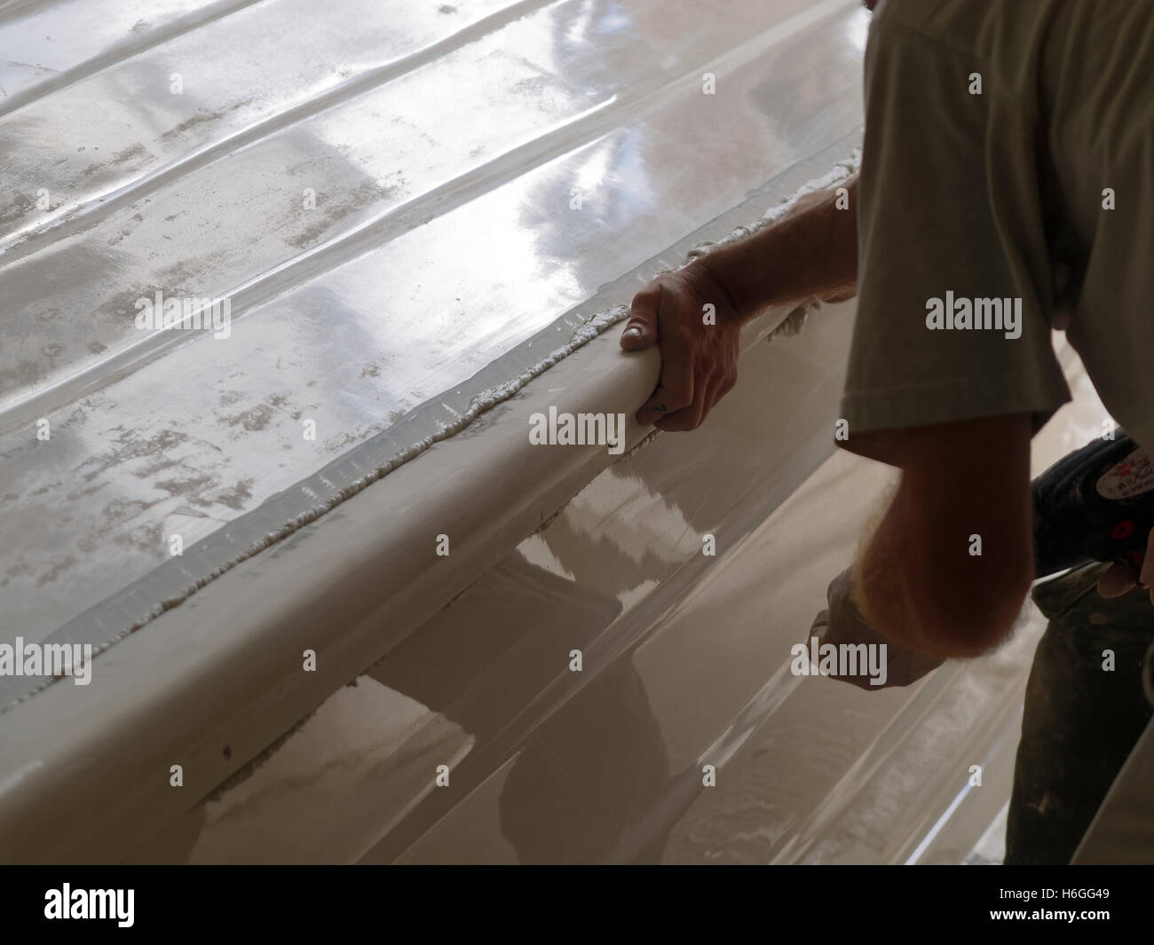 Boat side stabilizers mounting process Stock Photo - Alamy