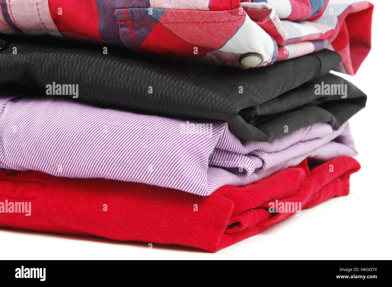 male shirts stack on white Stock Photo - Alamy