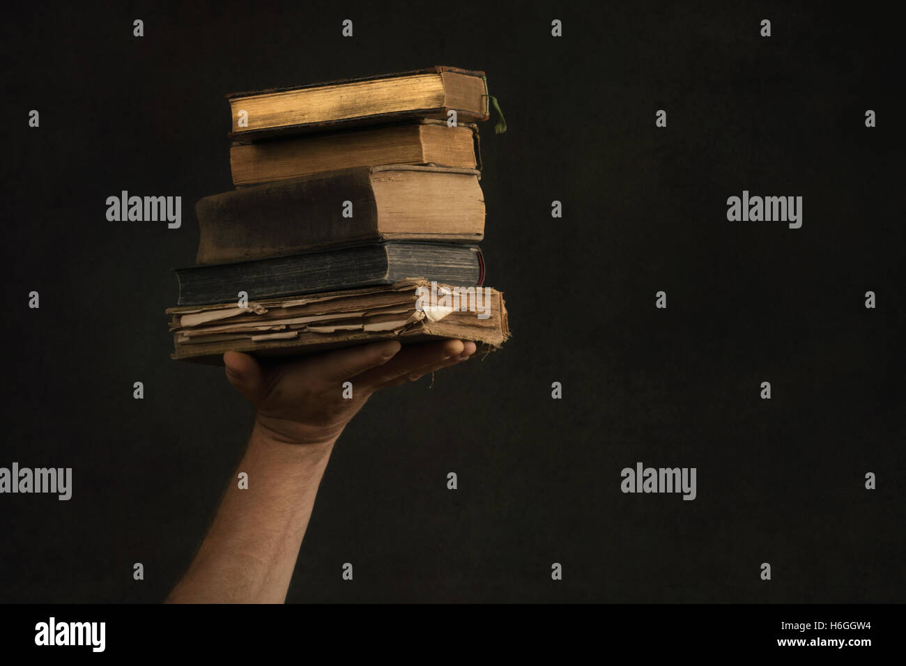 Holding book with one hand hi-res stock photography and images - Alamy