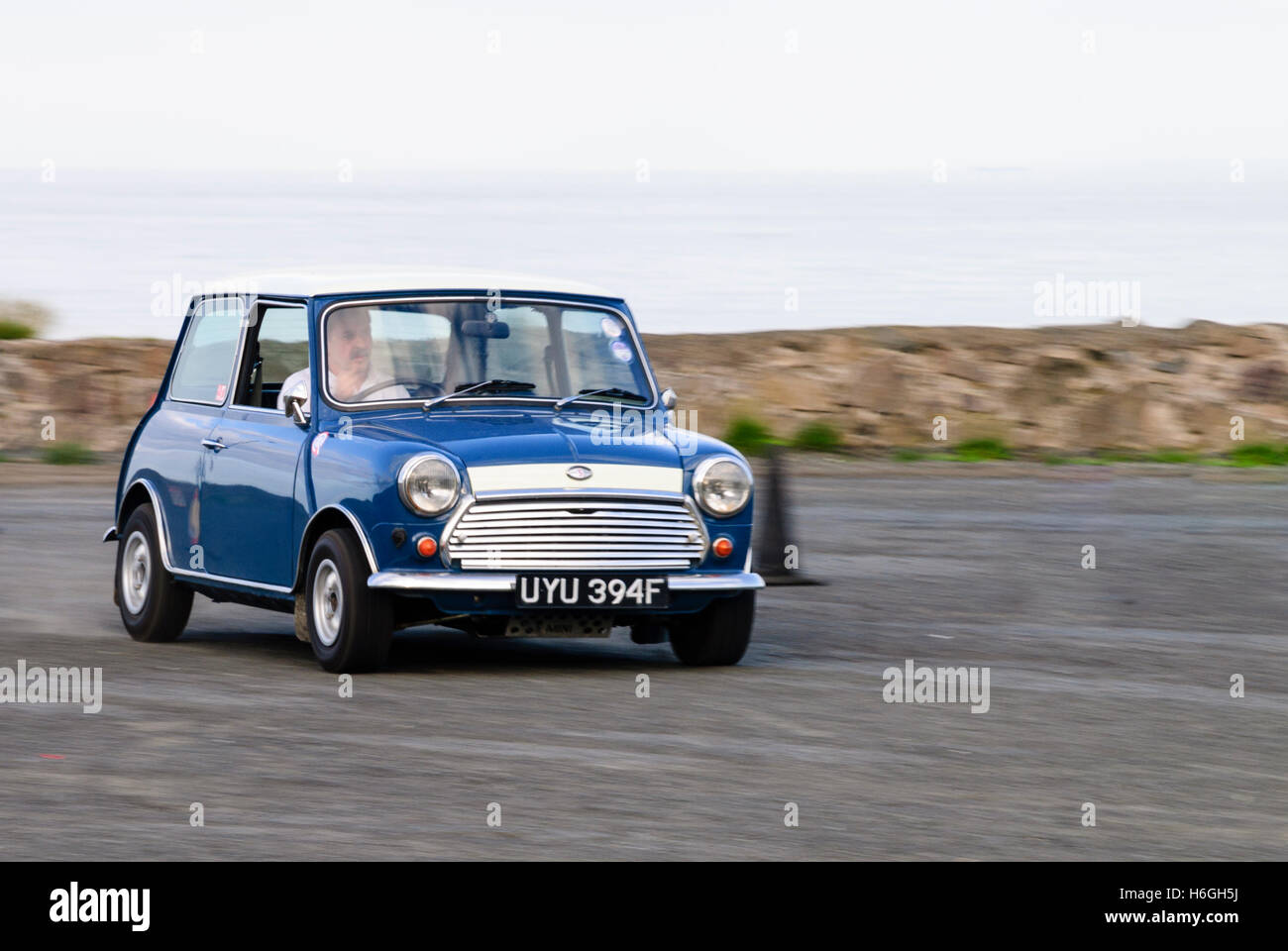 Blue Austin Mini Cooper S driven at speed Stock Photo - Alamy