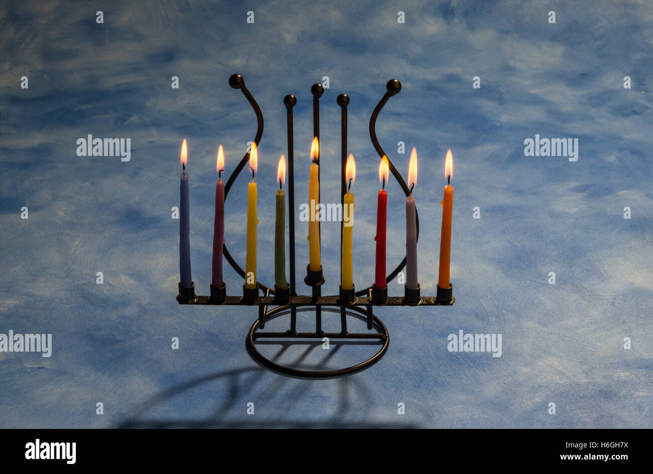 Blue burning candle in candlestick hi-res stock photography and images ...