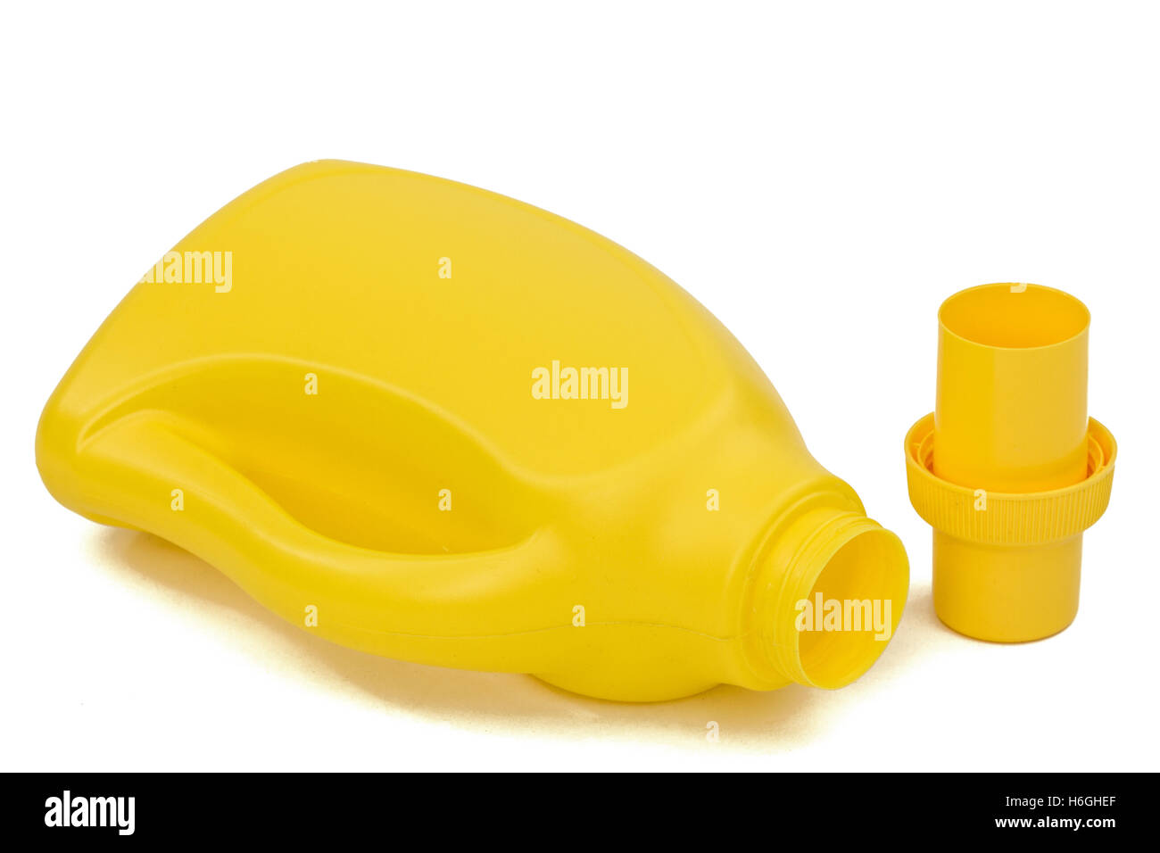 Yellow plastic bottle with a dispenser in cap, isolated on white ...