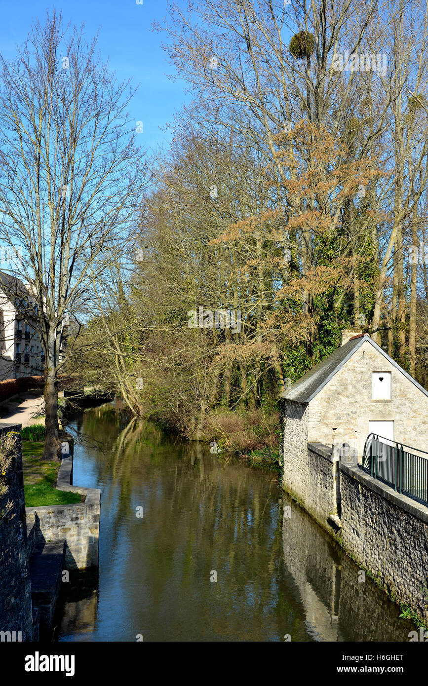 River Aure with trees in the town of Bayeux, a commune in the Calvados ...