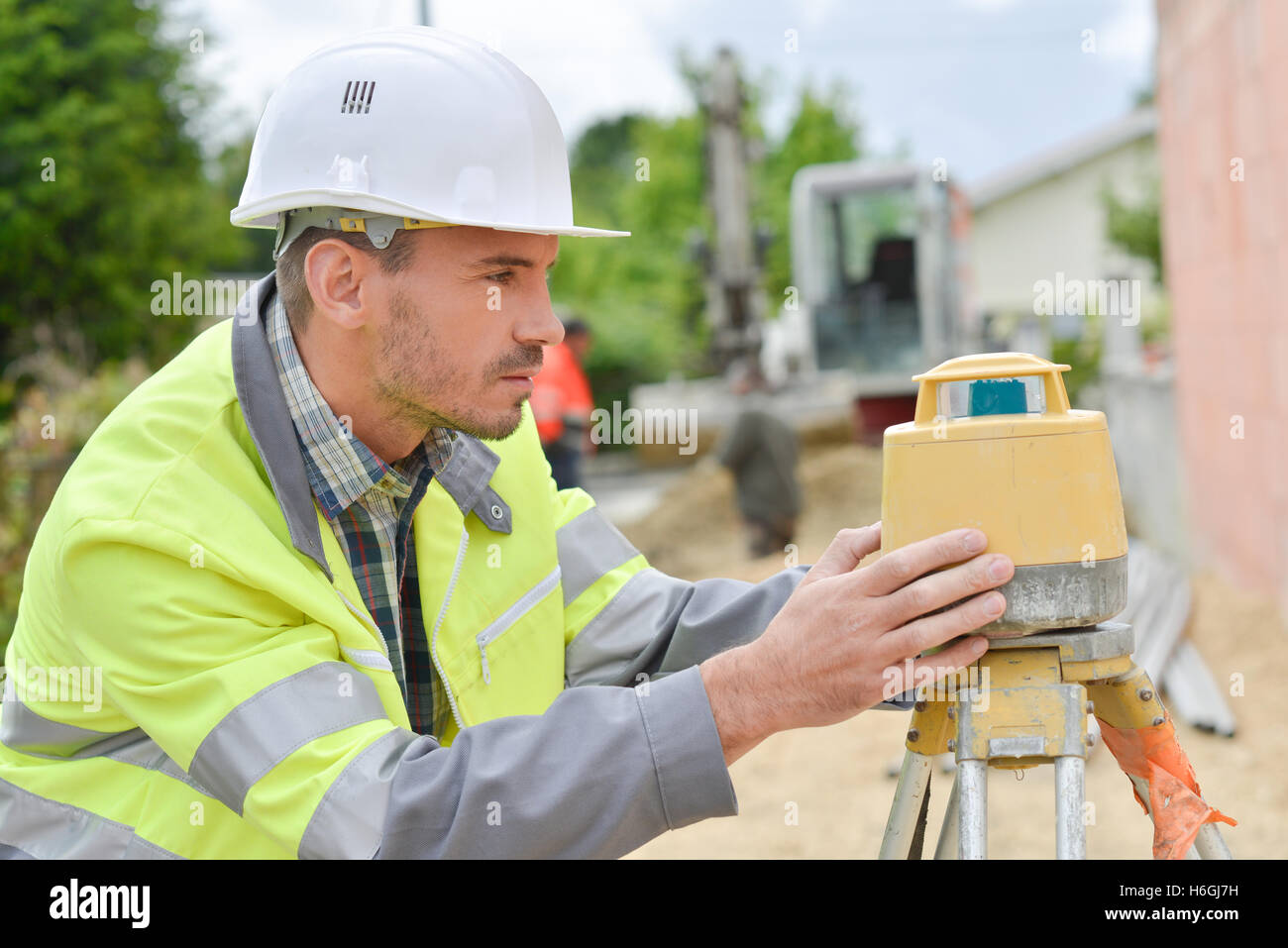 Surveyor taking some measurements Stock Photo - Alamy