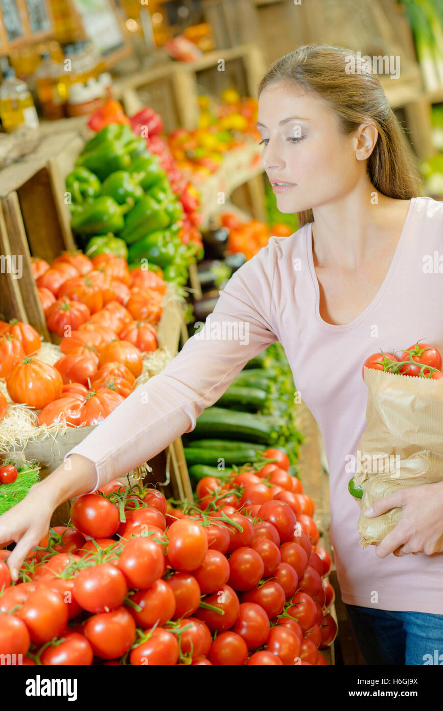 Shopping for some tomatoes Stock Photo - Alamy