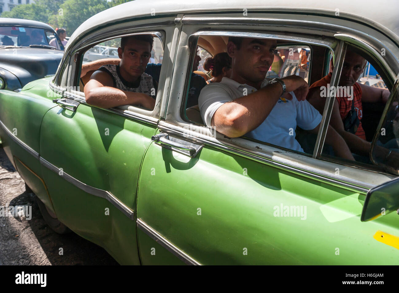 HAVANA - JUNE 12, 2011: Cuban passengers share a classic American taxi ...