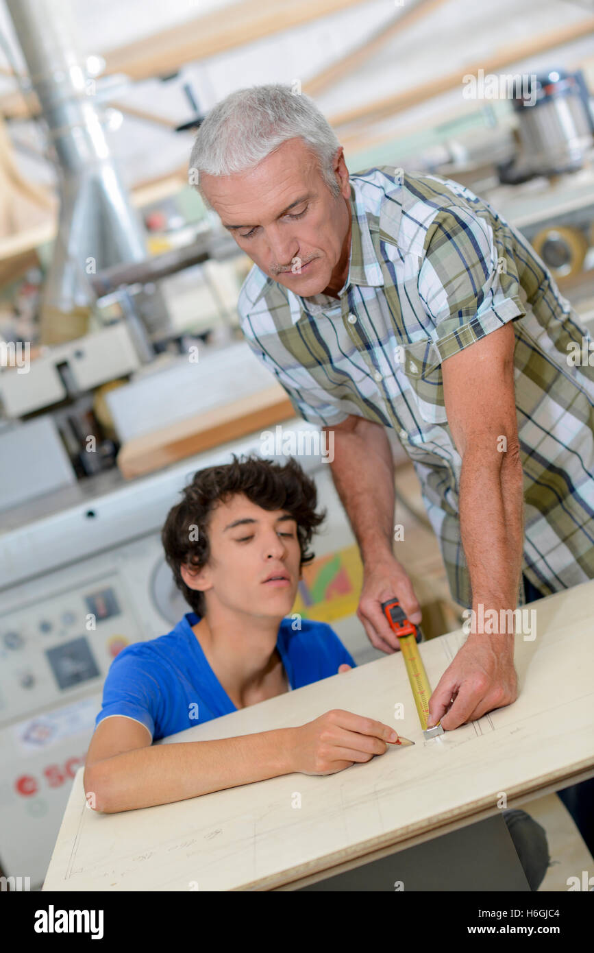 Two carpenters working together Stock Photo - Alamy