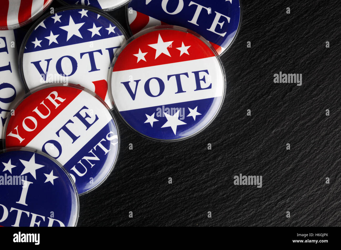 Red, white, and blue vote buttons background Stock Photo - Alamy