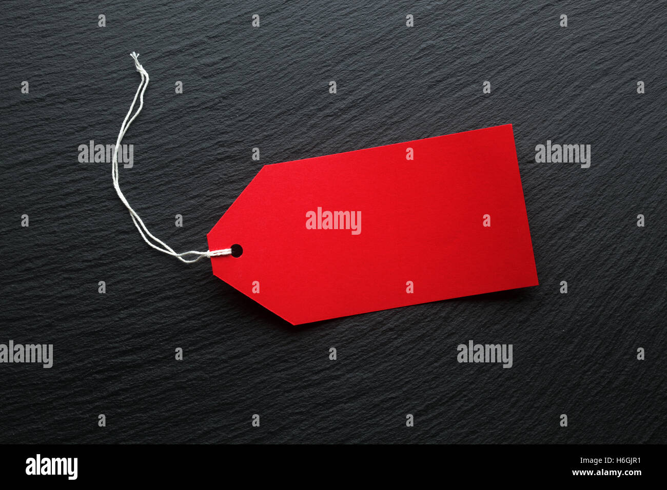 Blank price tags on dark background Stock Photo - Alamy