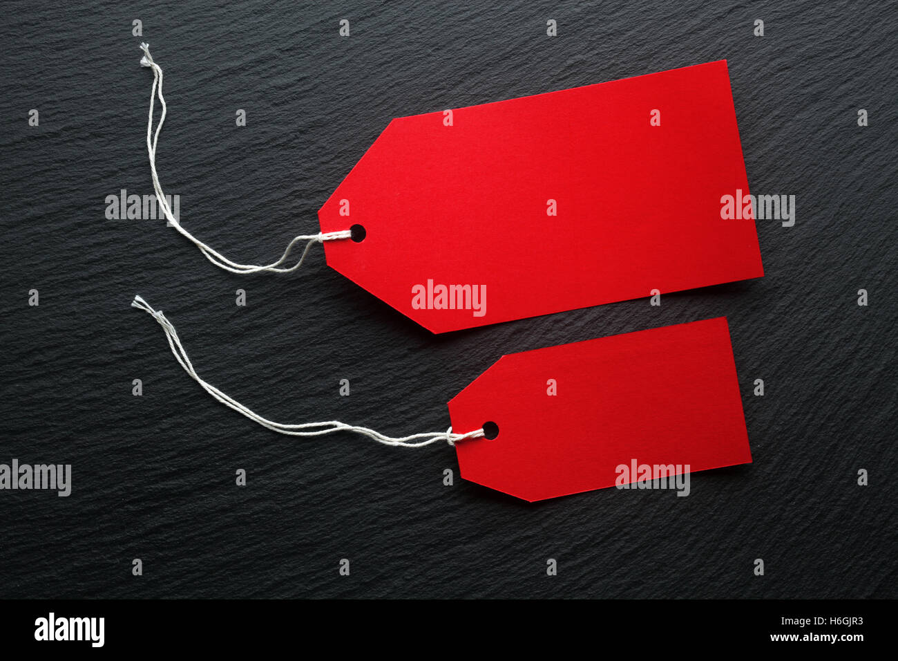 Blank price tags on dark background Stock Photo - Alamy
