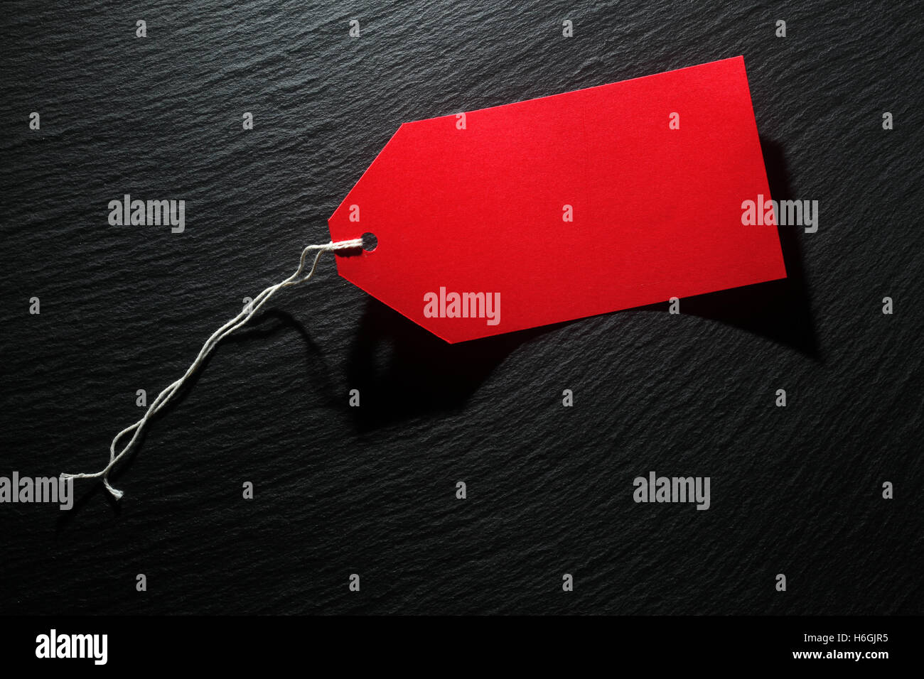 Blank price tags on dark background Stock Photo - Alamy