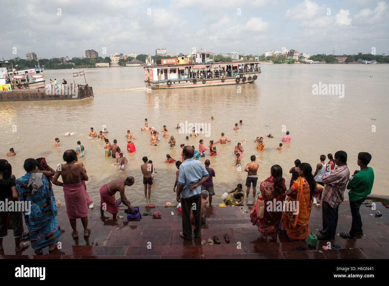 Hindu people bathing on Ahiritola ghat Hooghly River Kolkata West ...