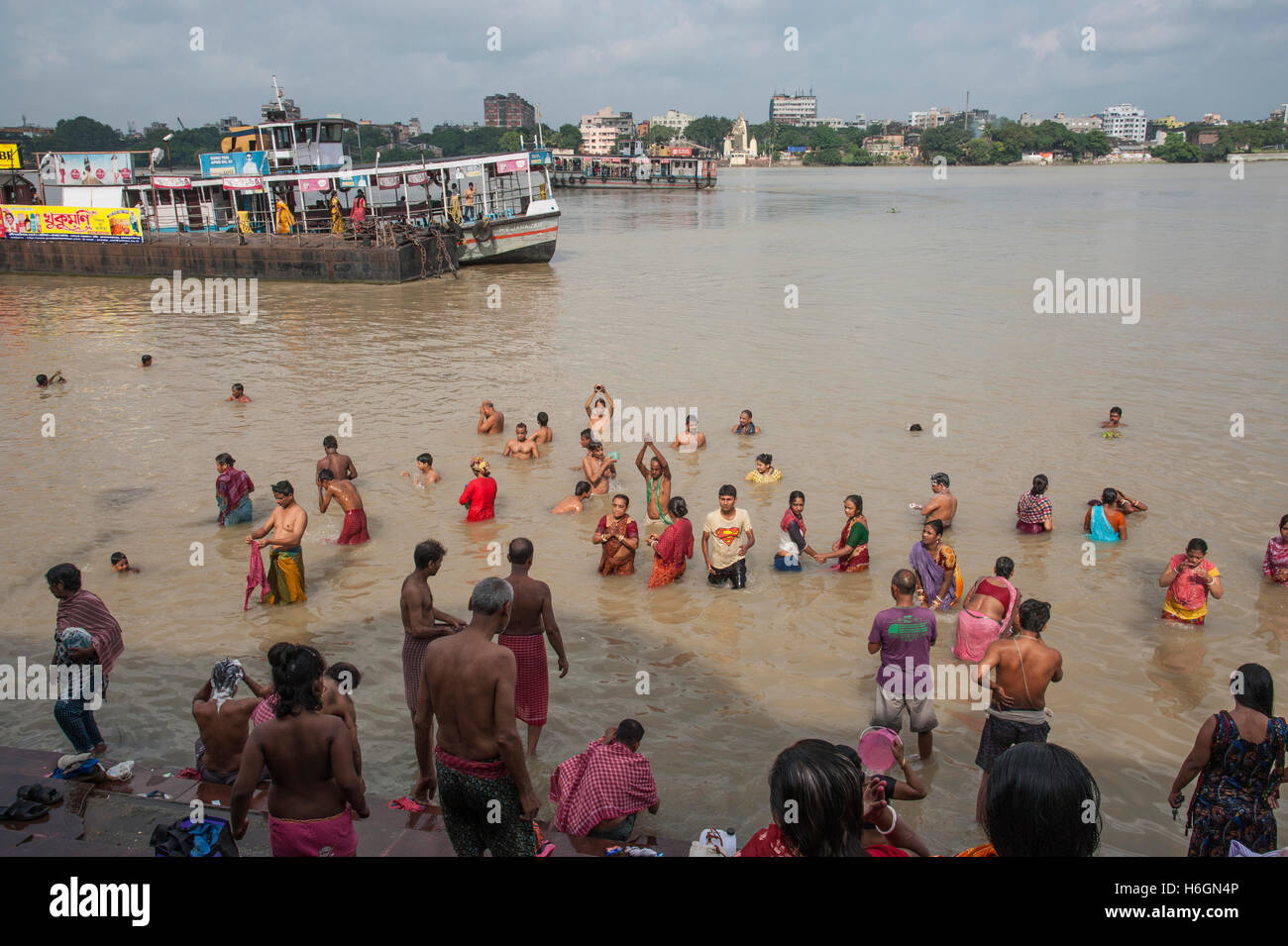 Hindu people bathing on Ahiritola ghat Hooghly River Kolkata West ...